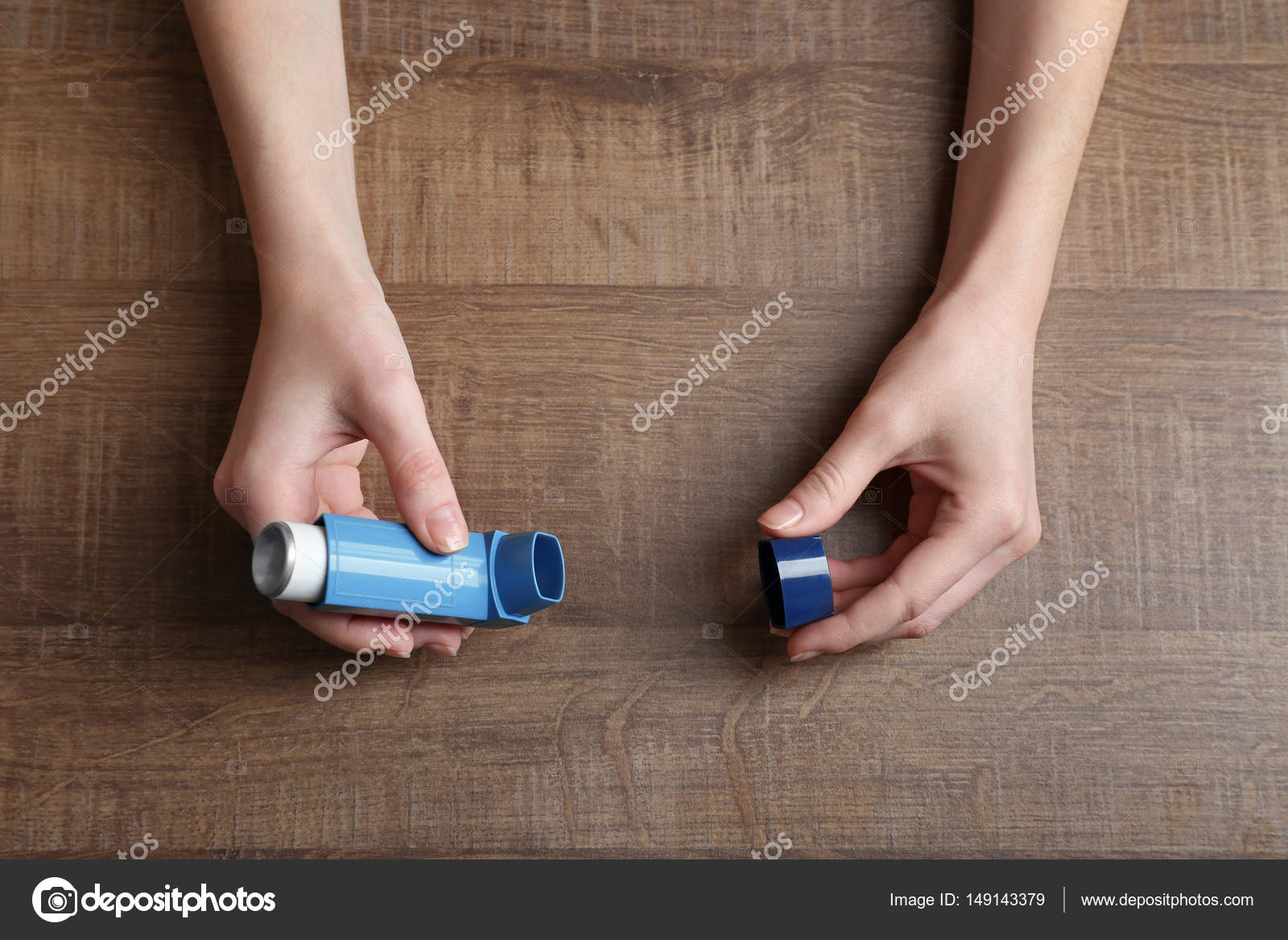 Hands holding asthma inhaler Stock Photo by ©belchonock 149143379