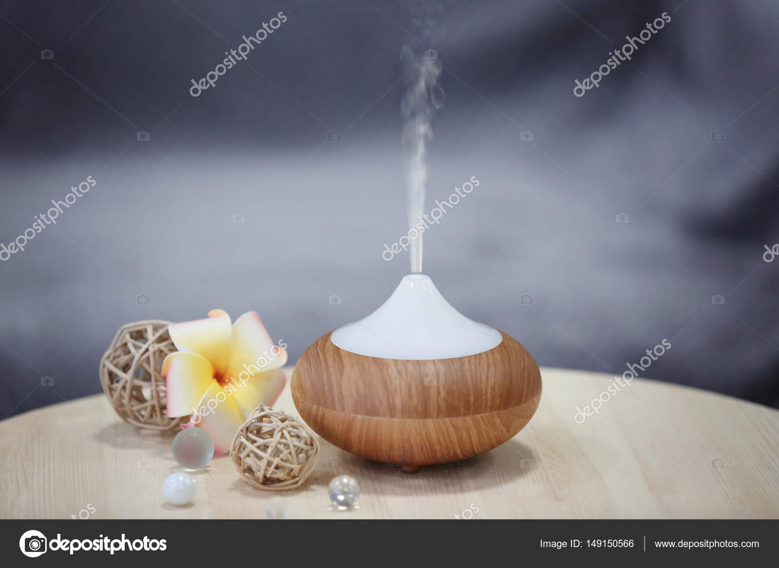 Spa concept. Aroma oil diffuser on table against blurred background ...