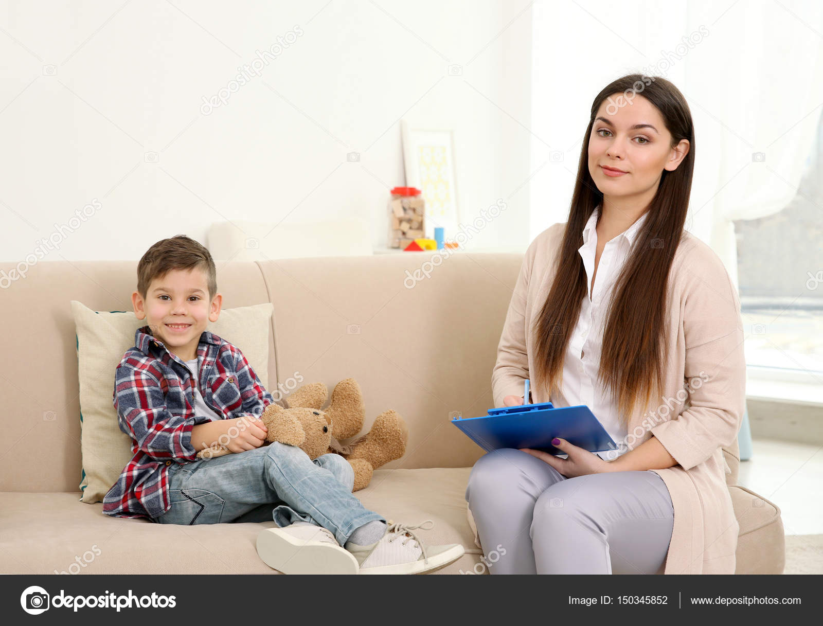 Young child psychologist working with little boy Stock Photo by ...