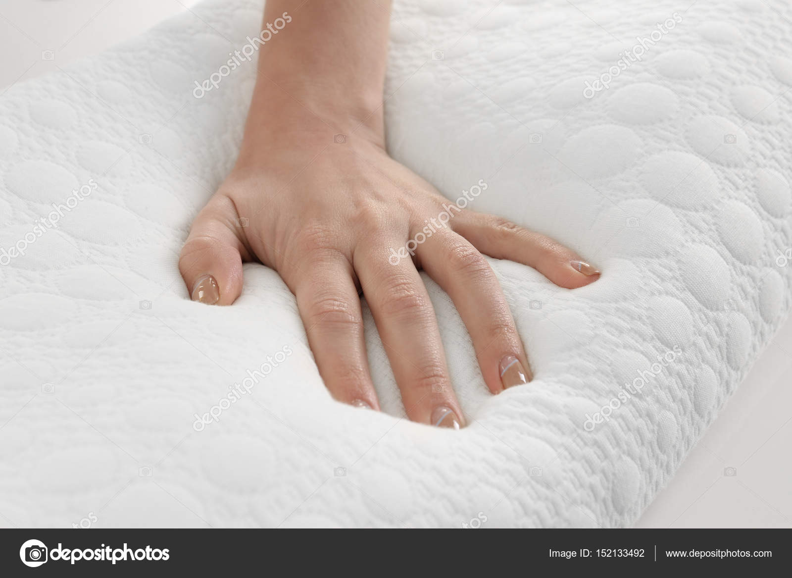 Female hand on orthopedic pillow Stock Photo by ©belchonock 152133492