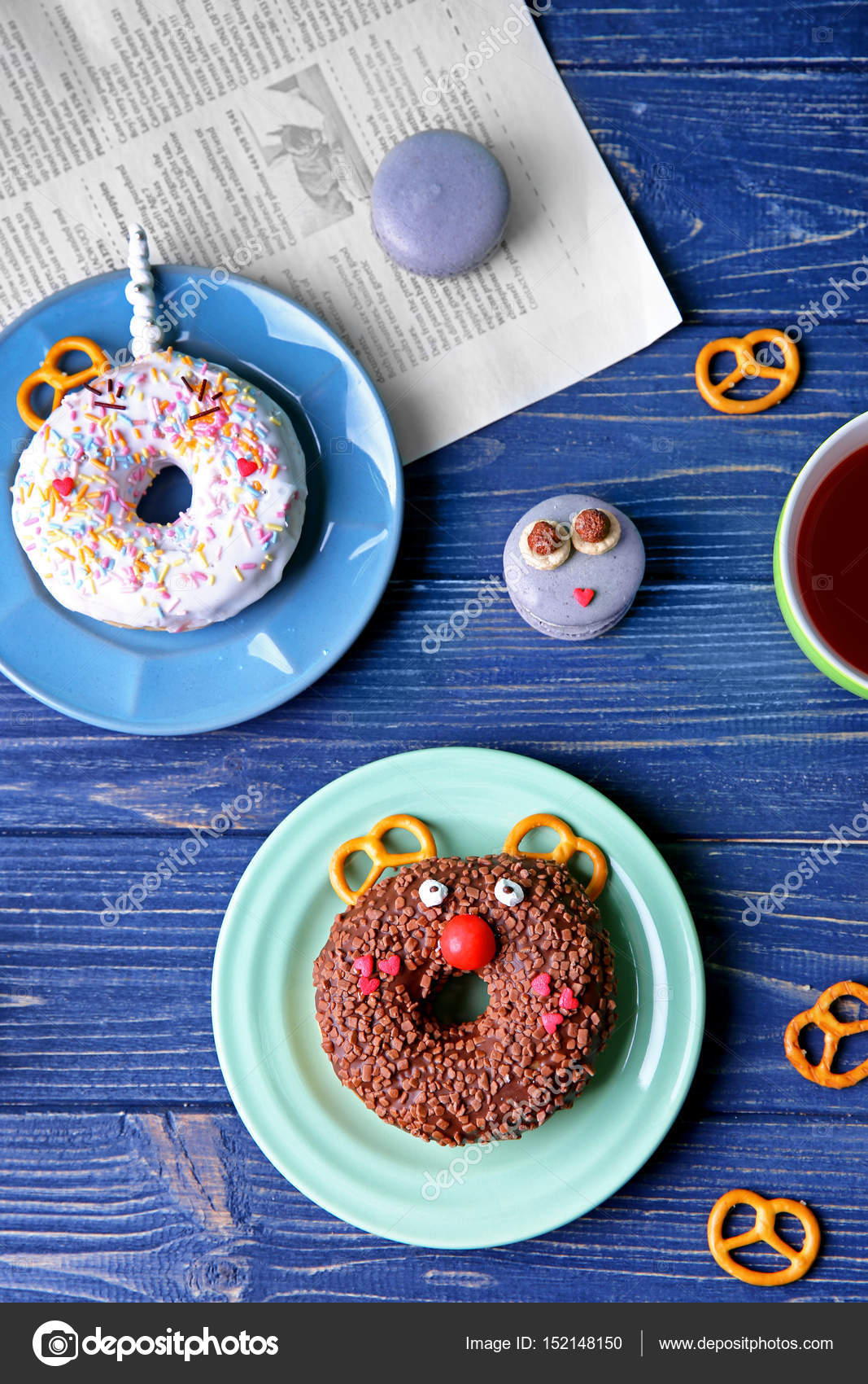 Plates with creative donuts Stock Photo by ©belchonock 152148150