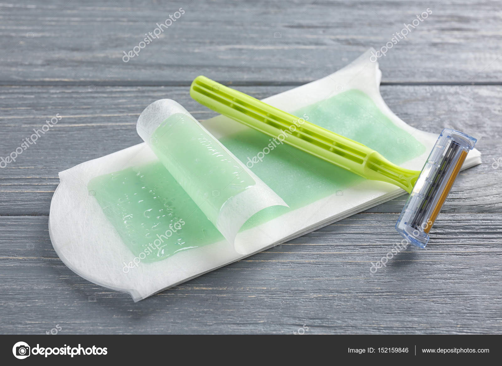Safety razor and wax strips Stock Photo by ©belchonock 152159846