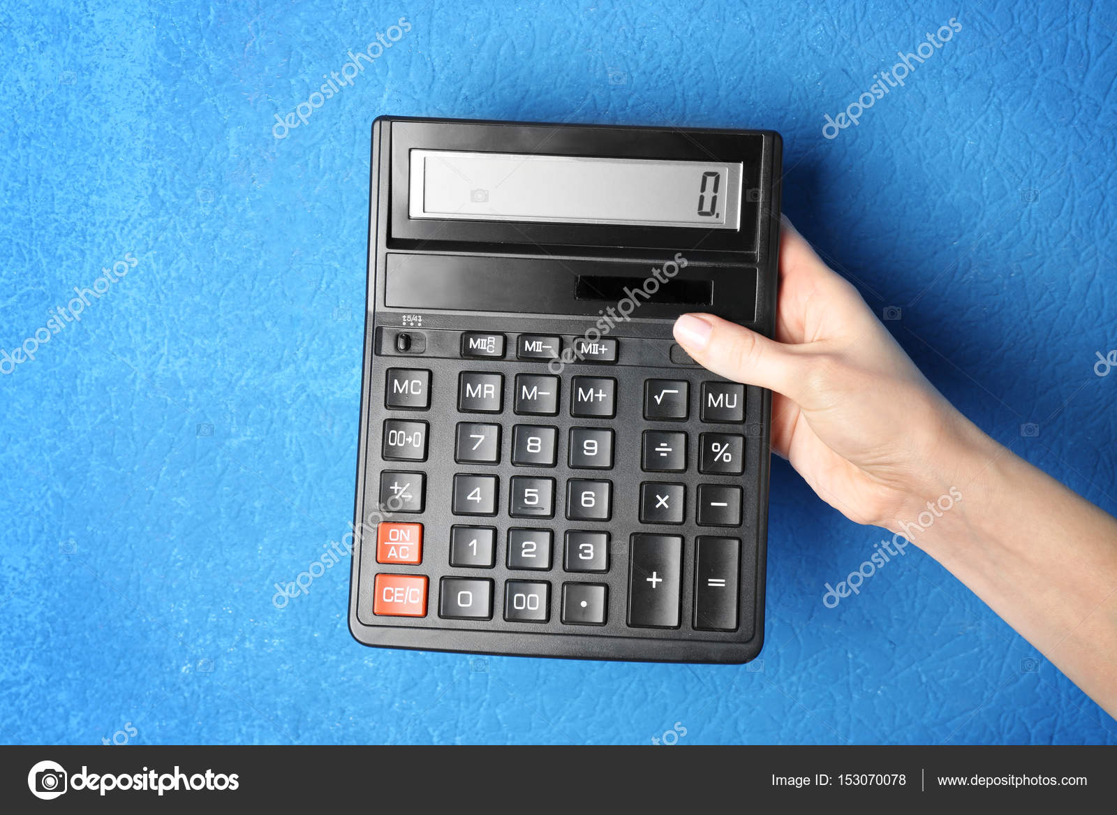 Female hand holding calculator — Stock Photo © belchonock #153070078