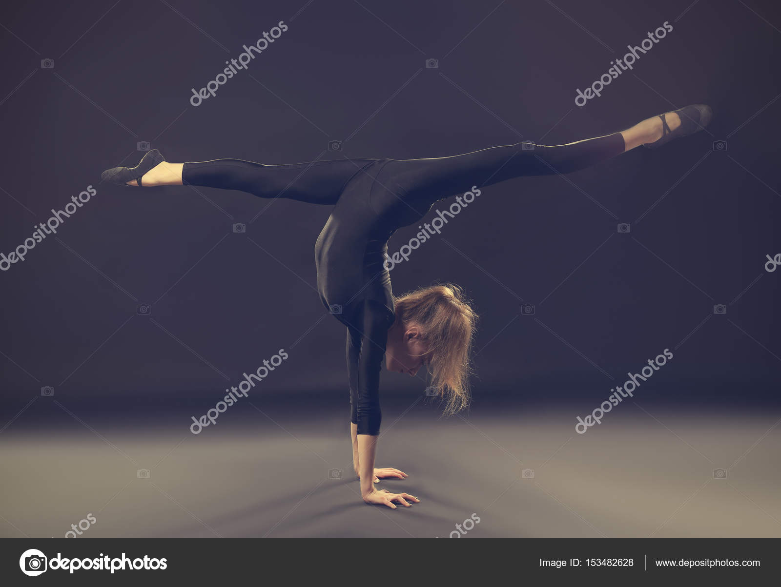 Young girl doing gymnastics Stock Photo by ©belchonock 153482628