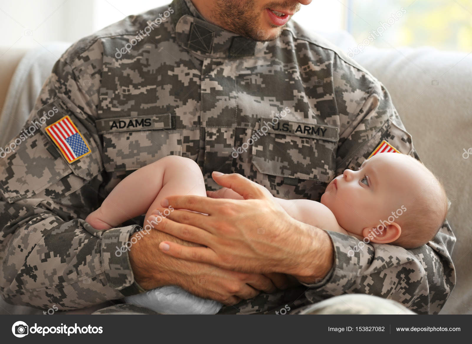 Military father holding his newborn baby Stock Photo by ©belchonock ...