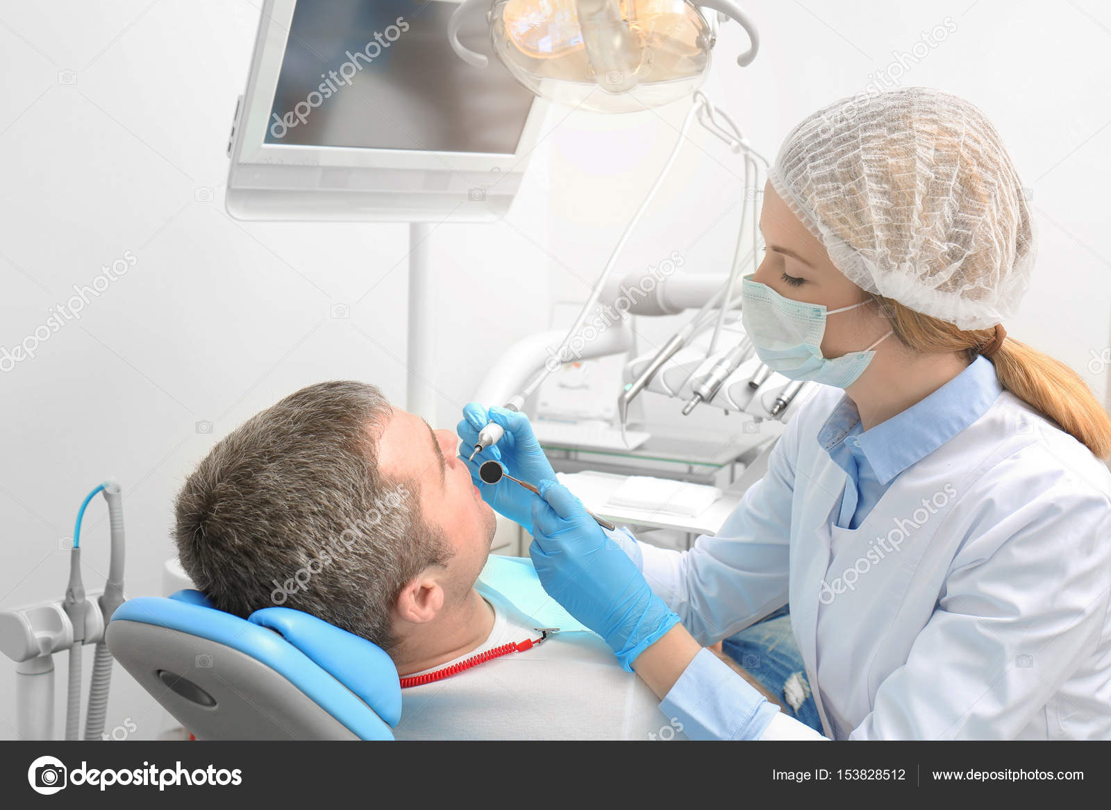 Dentist examining patient's teeth in clinic ⬇ Stock Photo, Image by ...