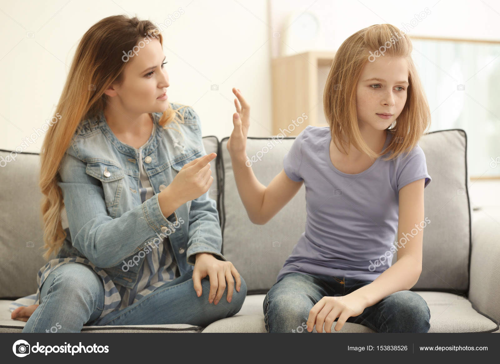 Quarrel between mother and daughter — Stock Photo © belchonock #153838526