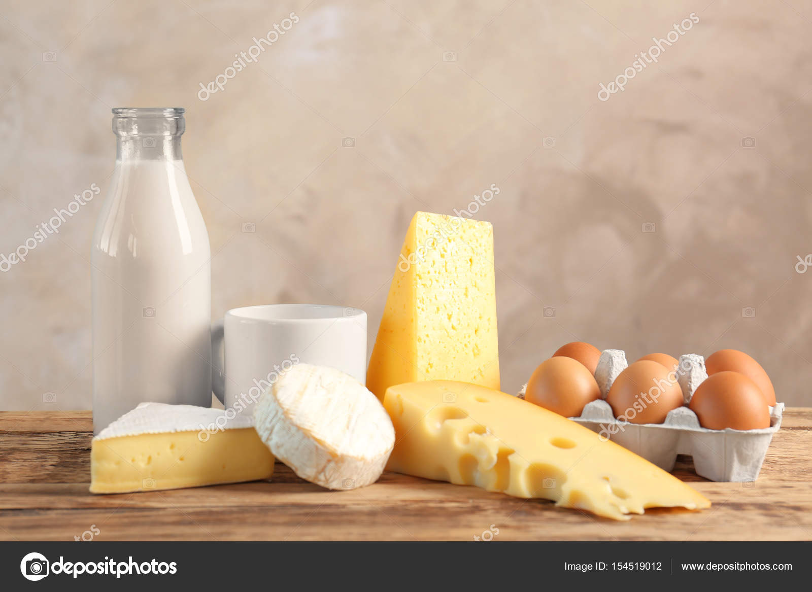 Dairy products on table Stock Photo by ©belchonock 154519012