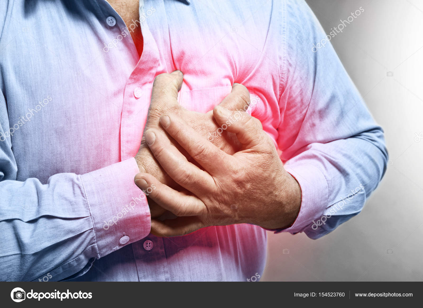 Man suffering from chest pain — Stock Photo © belchonock #154523760