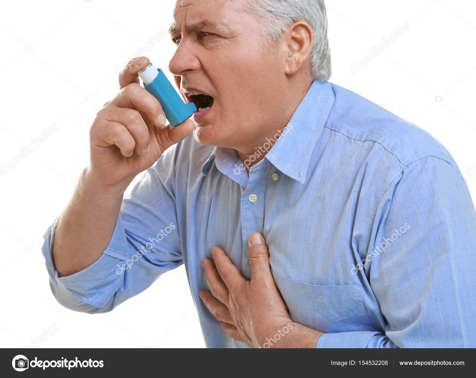 Elderly man using inhaler — Stock Photo © belchonock #154532208