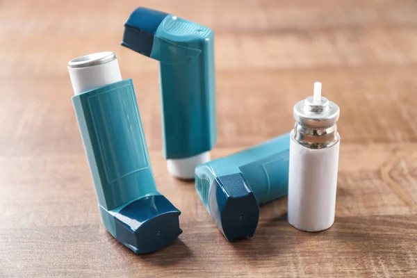 Blue Asthma inhalers Stock Photo by ©belchonock 150325218