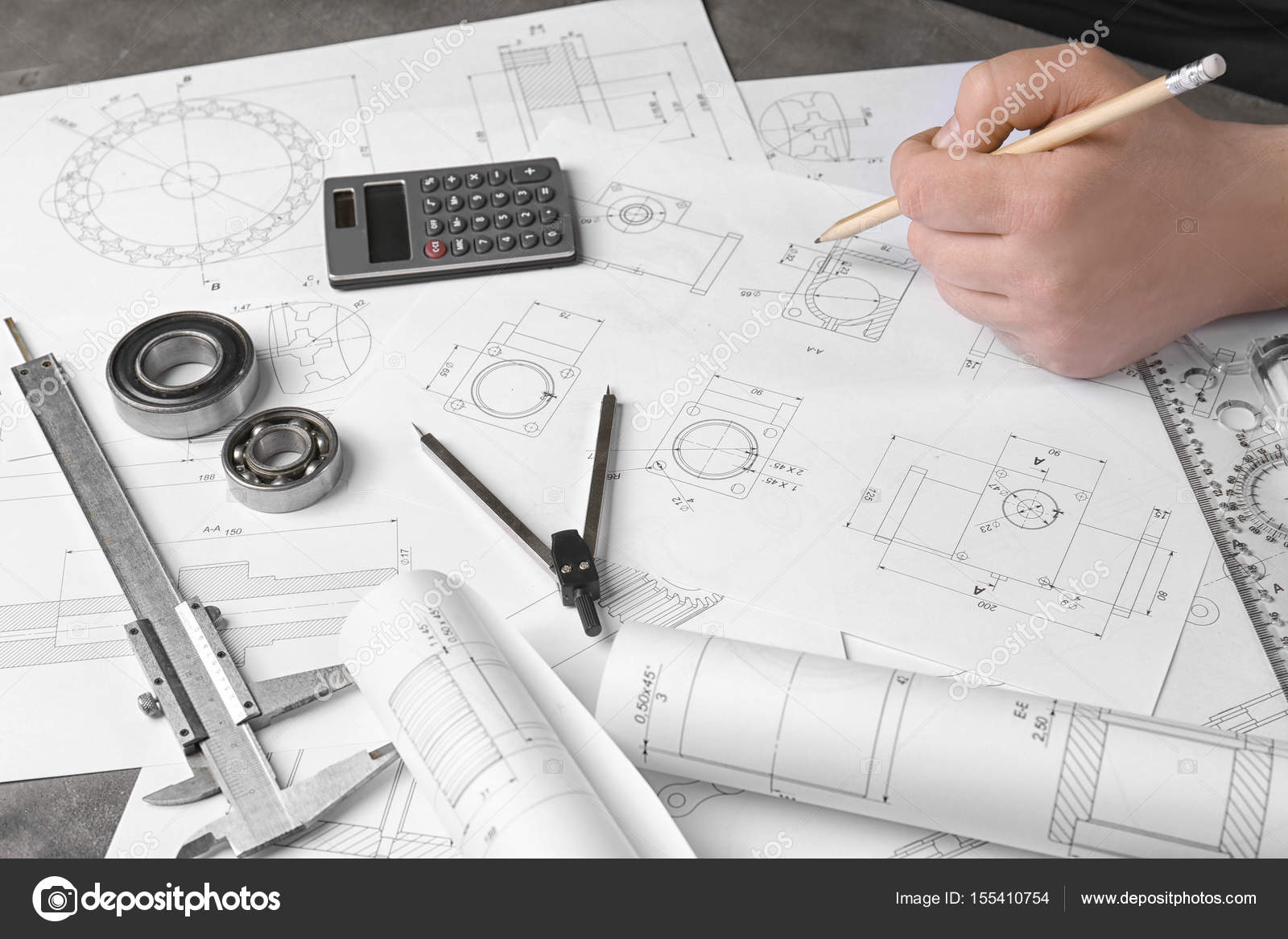 Engineer working with part blueprints on workplace — Stock Photo ...