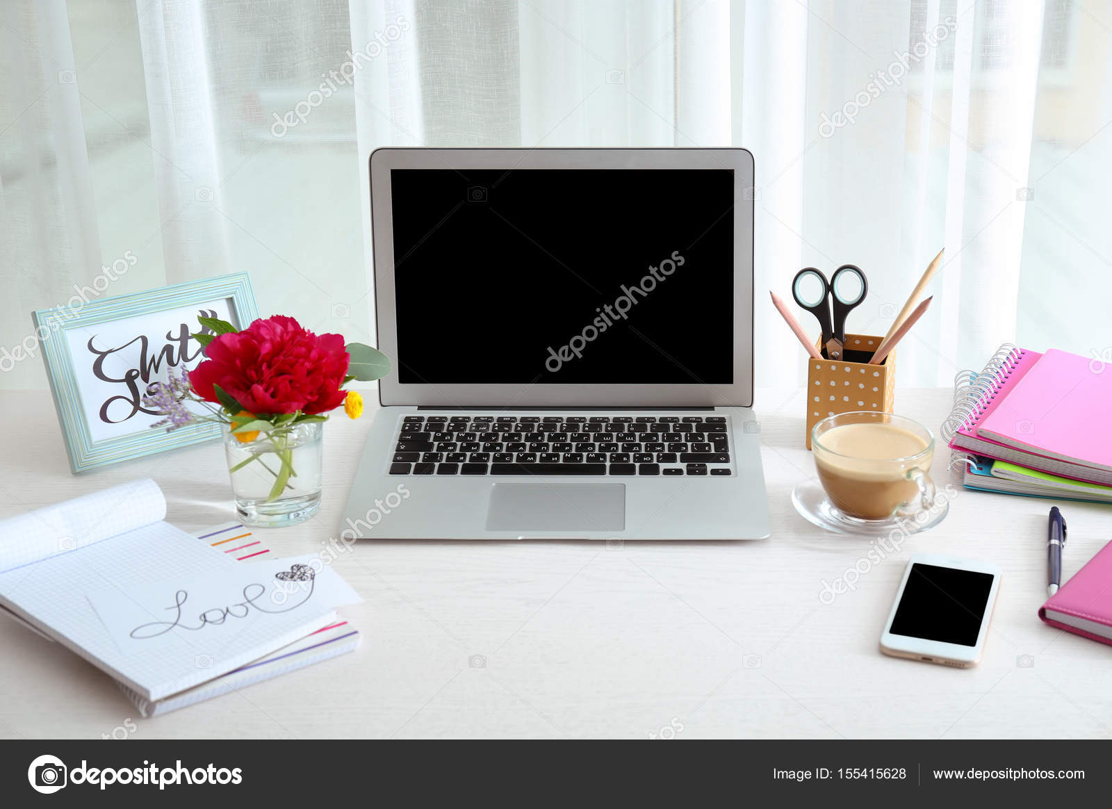 Beautiful flowers and laptop on workplace — Stock Photo © belchonock ...