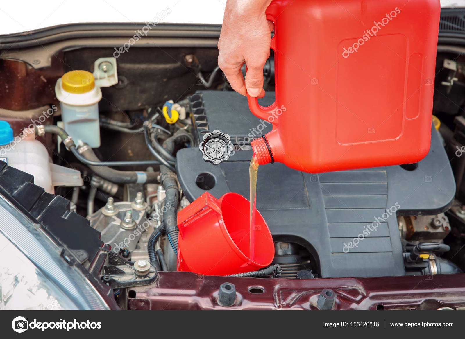 Male hand pouring engine oil Stock Photo by ©belchonock 155426816 Male hand pouring engine oil Stock Photo by ©belchonock 155426816