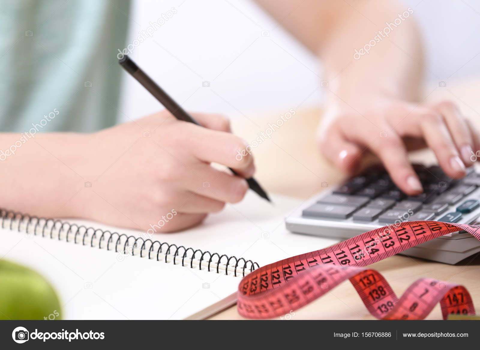 Woman writing diet plan — Stock Photo © belchonock #156706886