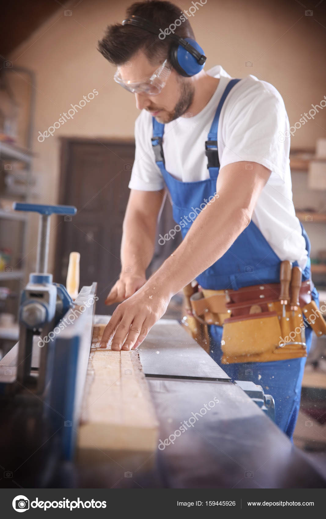 Carpenter working with timber — Stock Photo © belchonock #159445926