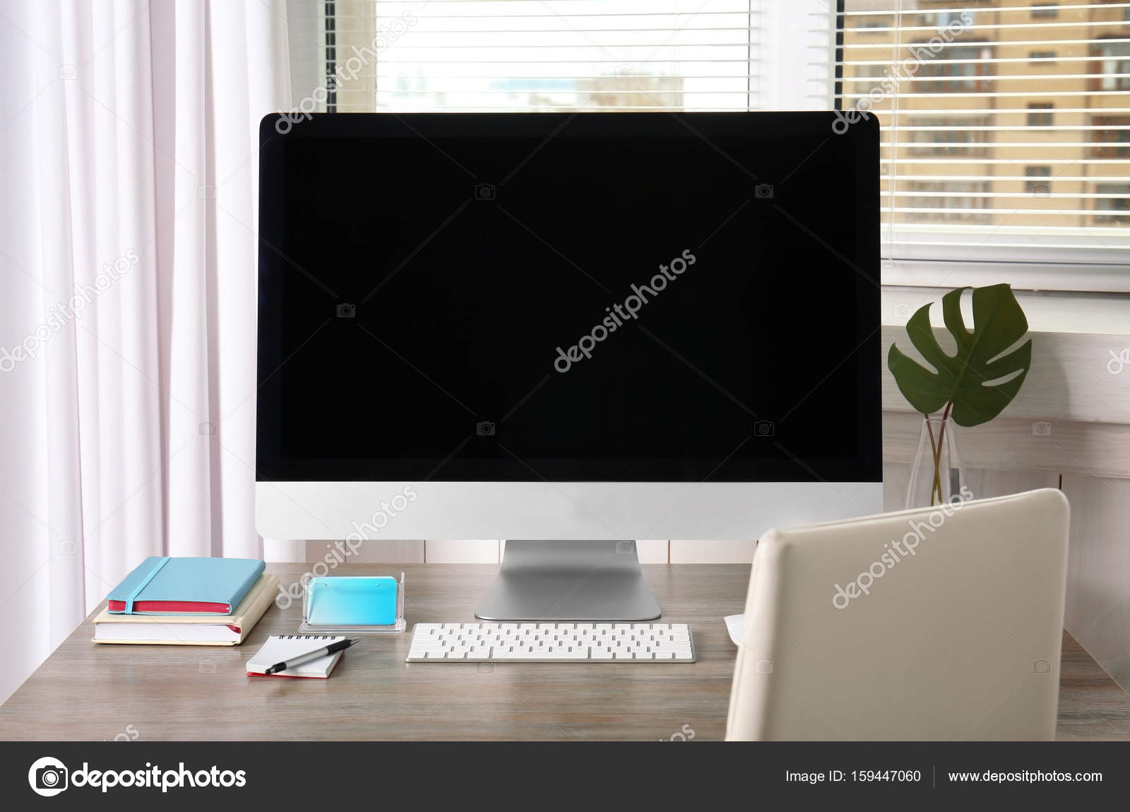 Workplace with modern monitor Stock Photo by ©belchonock 159447060