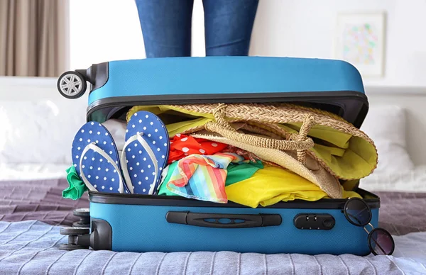 Open suitcase with personal stuff - Stock Image - Everypixel