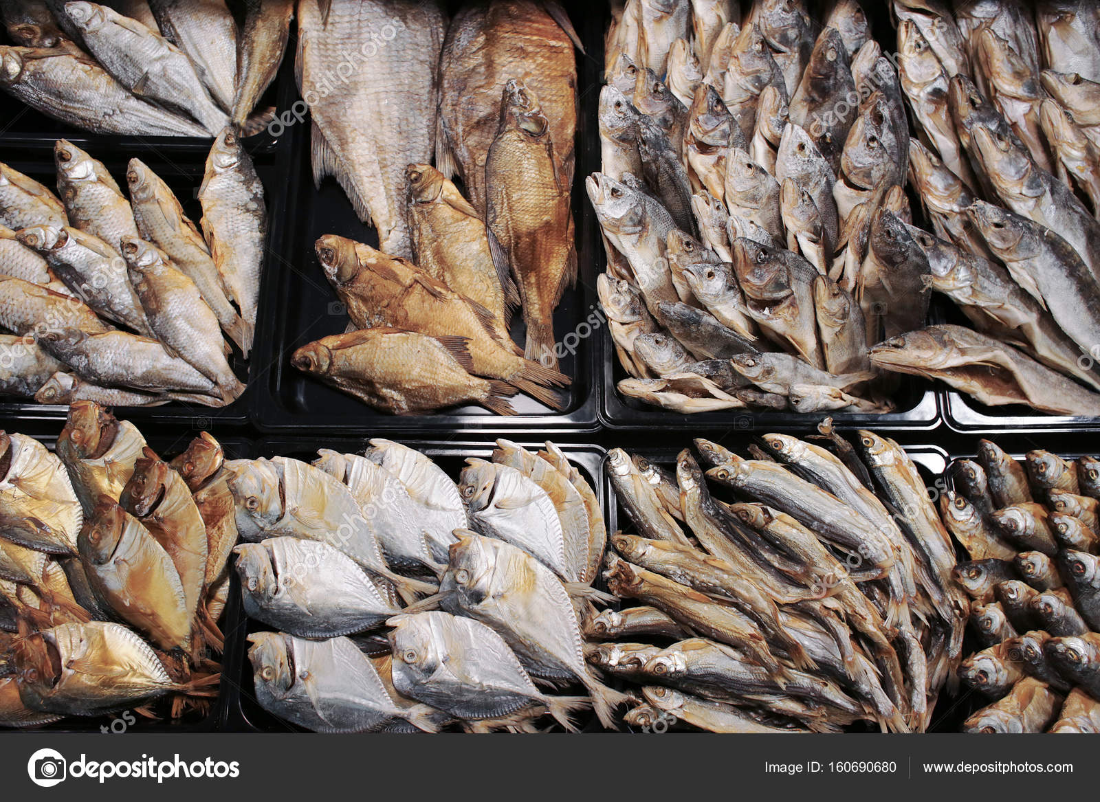 Dried and cured fish — Stock Photo © belchonock #160690680