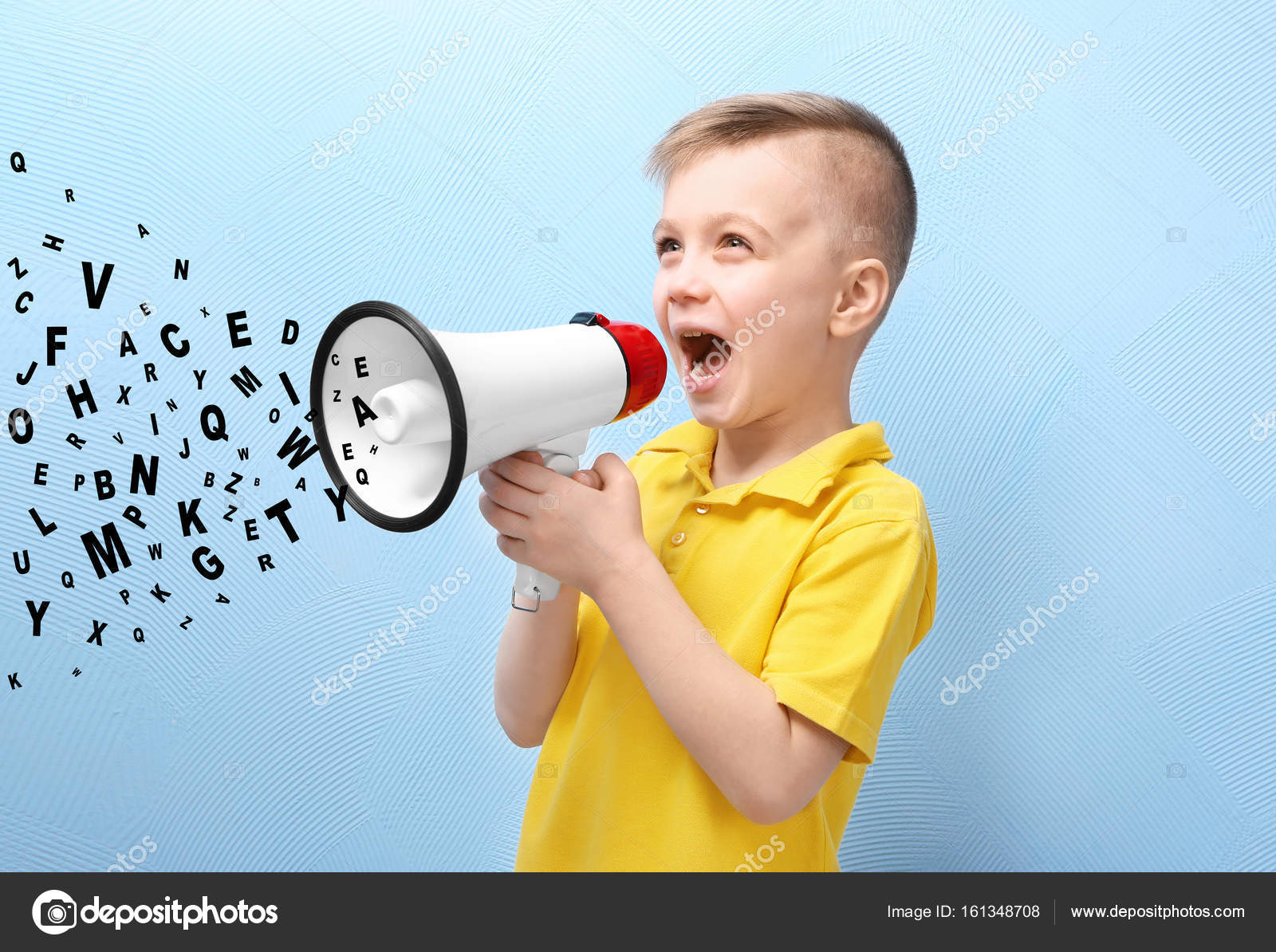 Little boy with megaphone and letters Stock Photo by ©belchonock 161348708