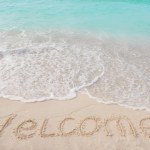 Word Welcome on beach Stock Photo by ©Violin 4307402