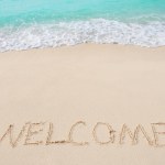 Word Welcome on beach Stock Photo by ©Violin 4307402