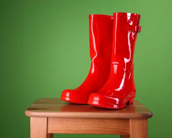 Red rubber boots Stock Photo by ©belchonock 169309044