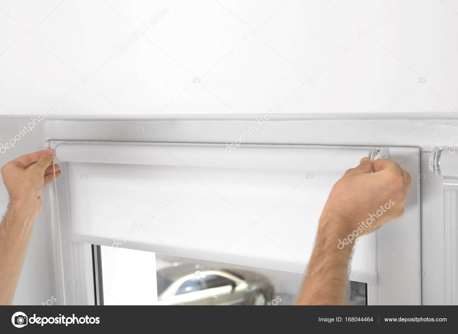Young man installing window screens indoors Stock Photo by ©belchonock ...