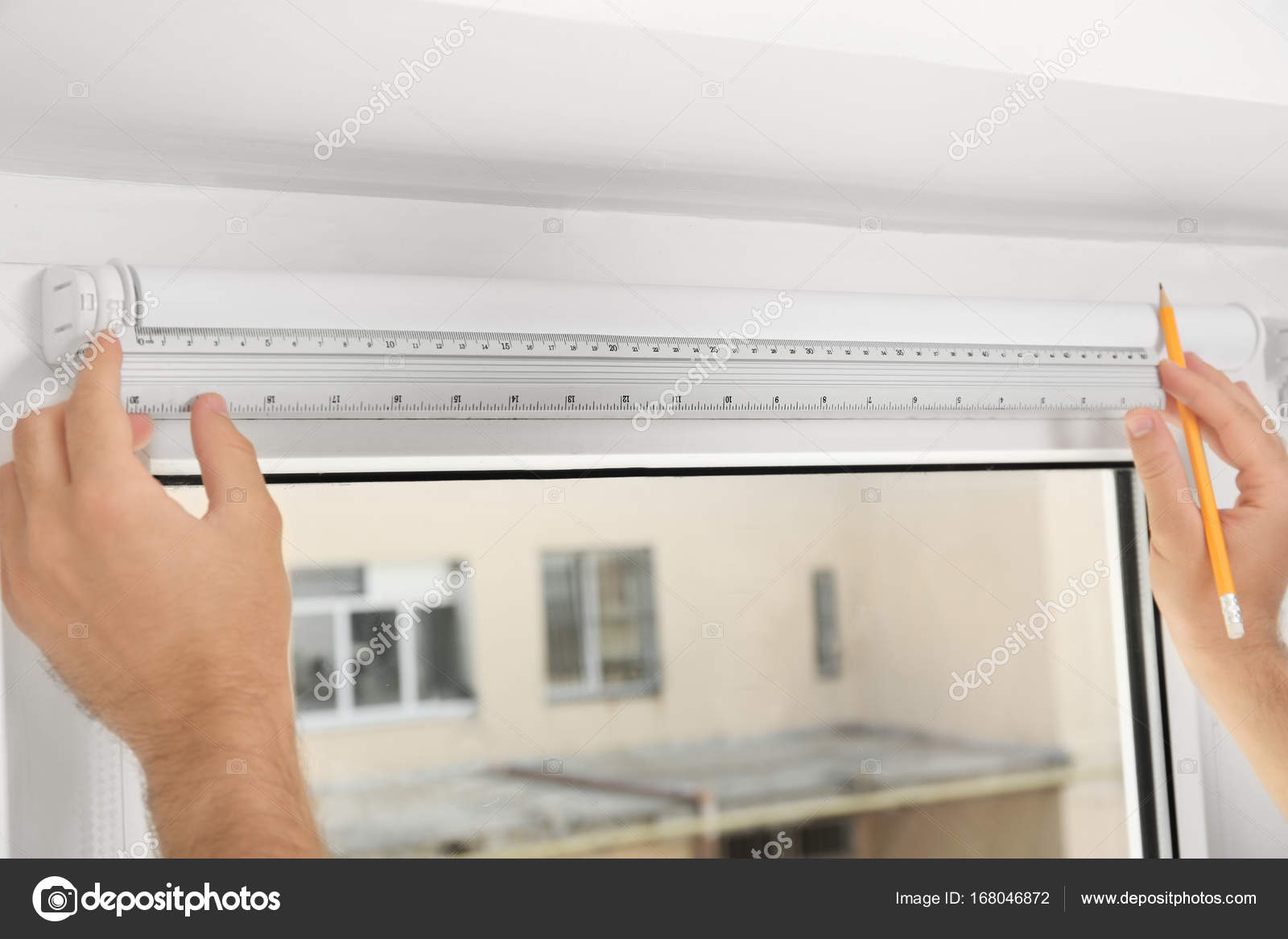 Young man installing window screens indoors — Stock Photo © belchonock ...