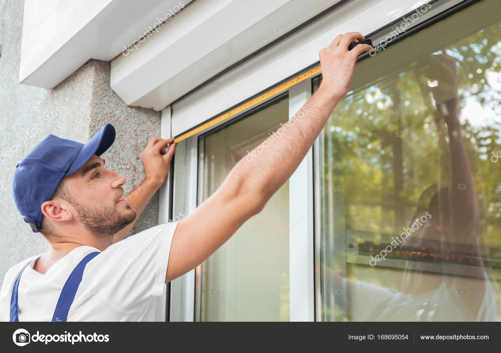 Man measuring window Stock Photo by ©belchonock 168695054 Man measuring window Stock Photo by ©belchonock 168695054