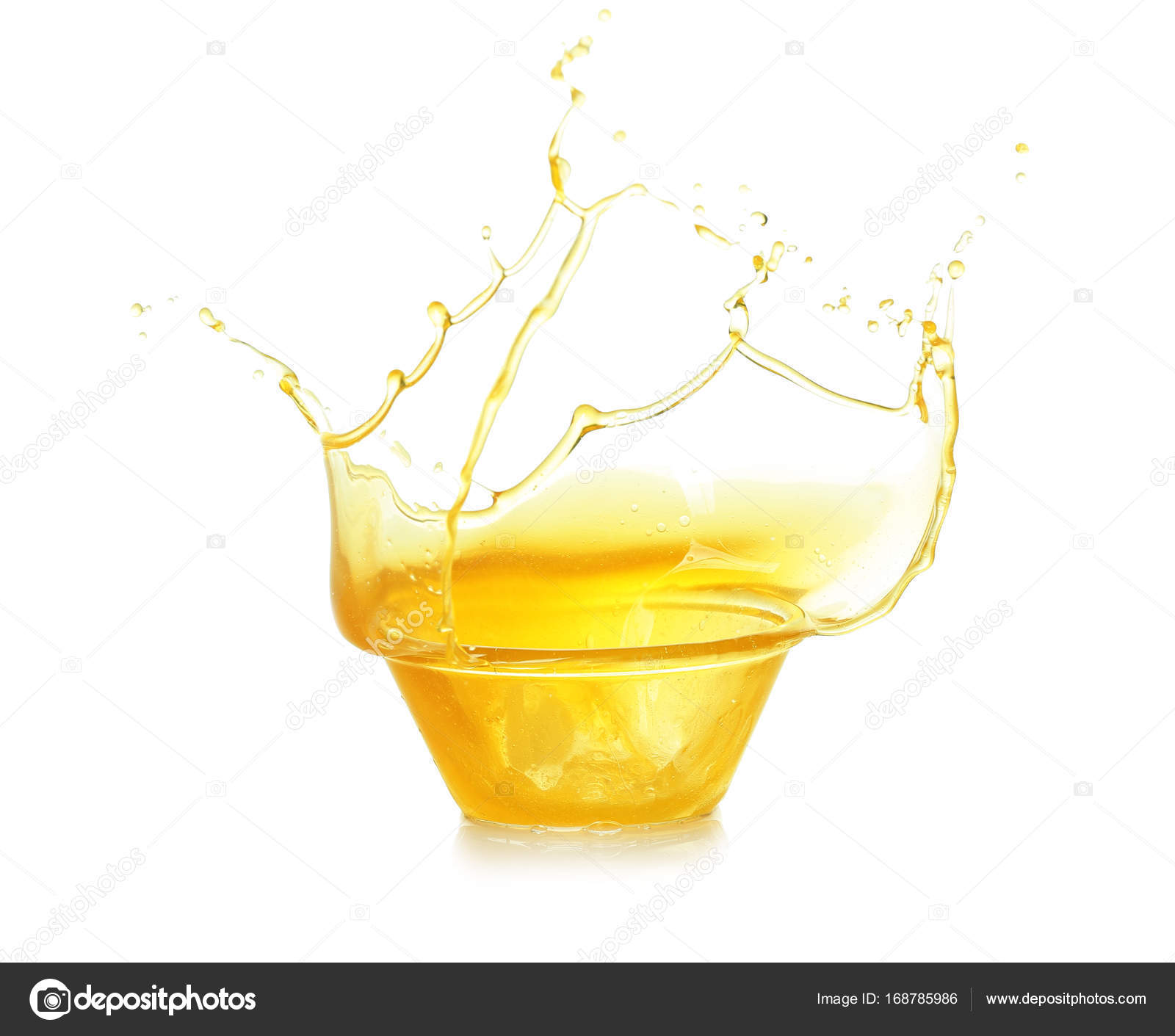 Cooking oil splashing from bowl, isolated on white Stock Photo by ...