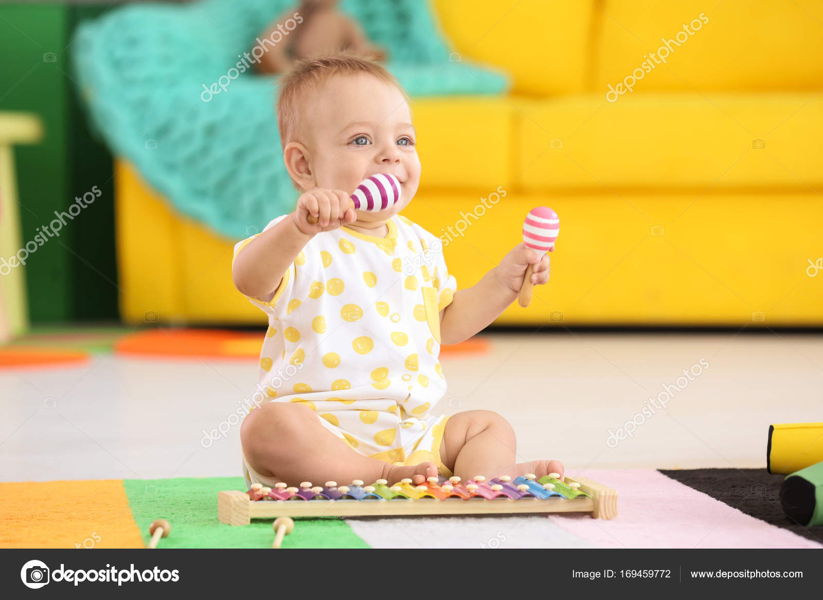 Cute little baby playing with musical instruments at home Stock Photo ...