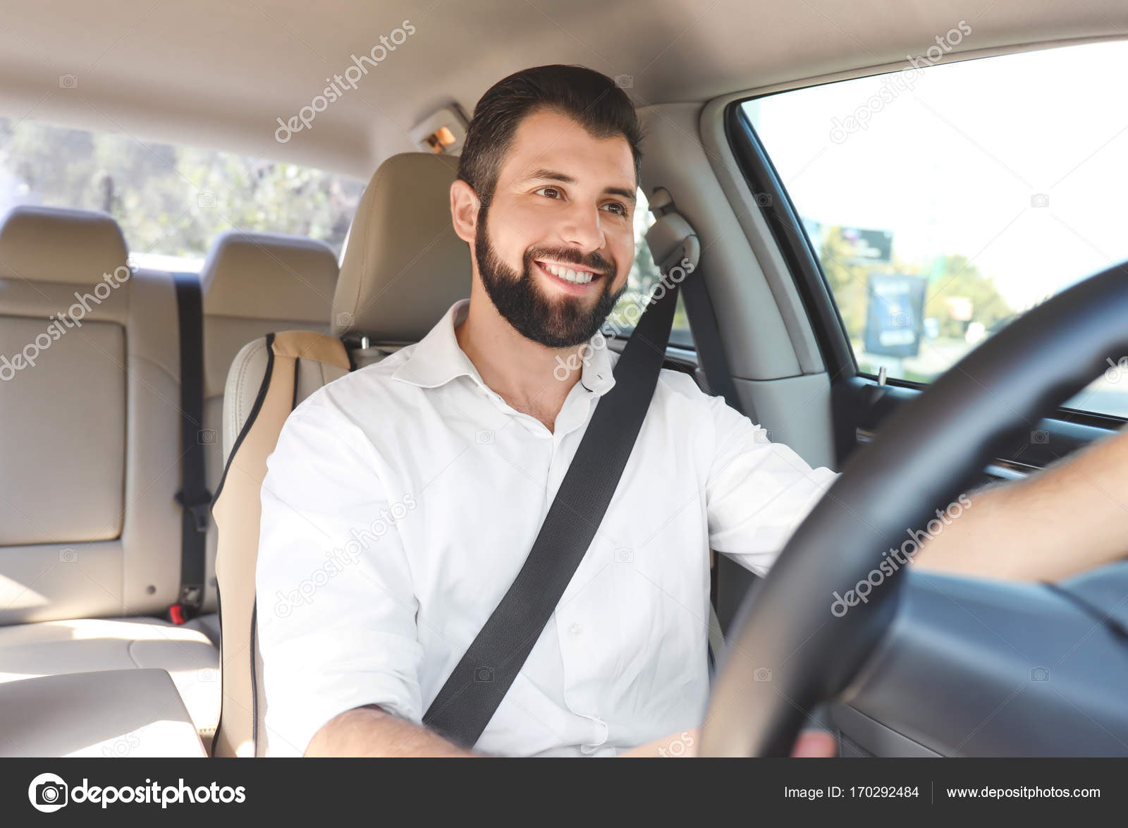 Man on driver's seat of car Stock Photo by ©belchonock 170292484