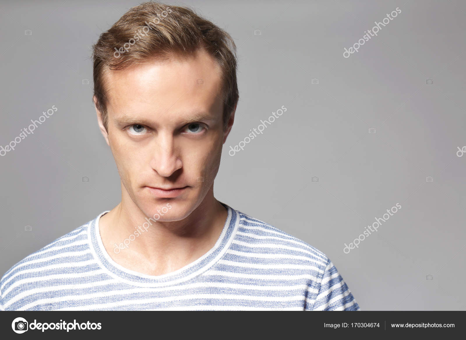 Handsome man on grey background — Stock Photo © belchonock #170304674