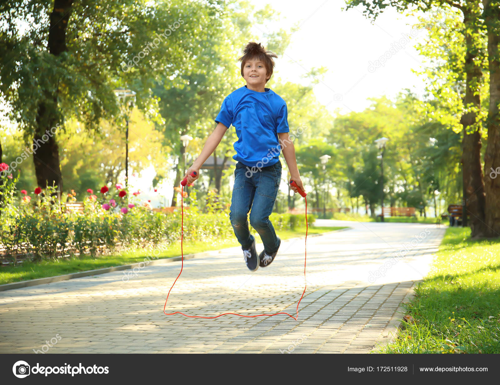 Cute little boy jumping rope Stock Photo by ©belchonock 172511928