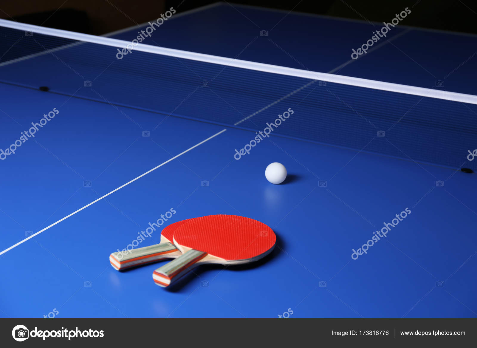 Ping pong rackets and ball on table Stock Photo by ©belchonock 173818776