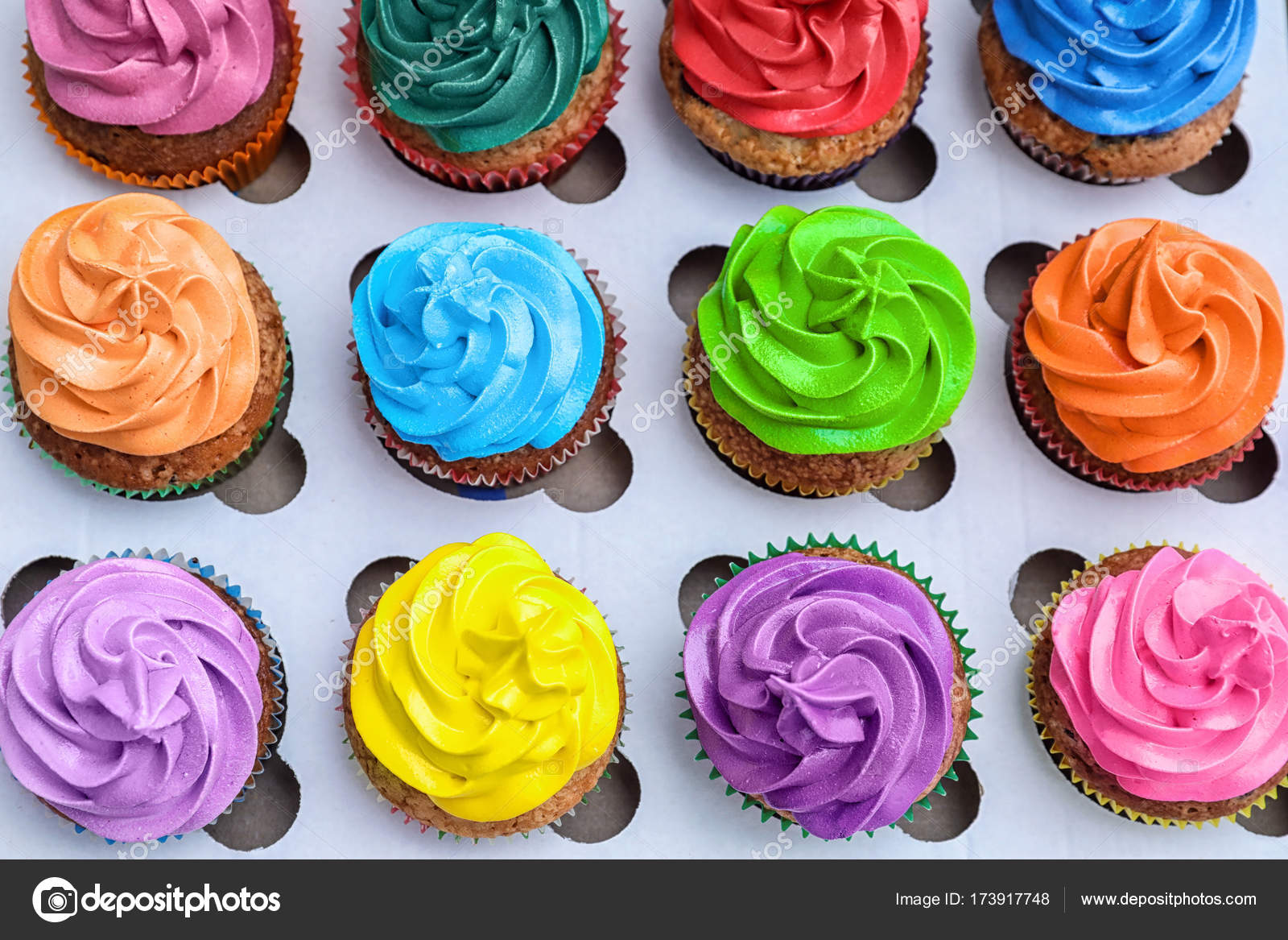 Tasty colorful cupcakes — Stock Photo © belchonock #173917748