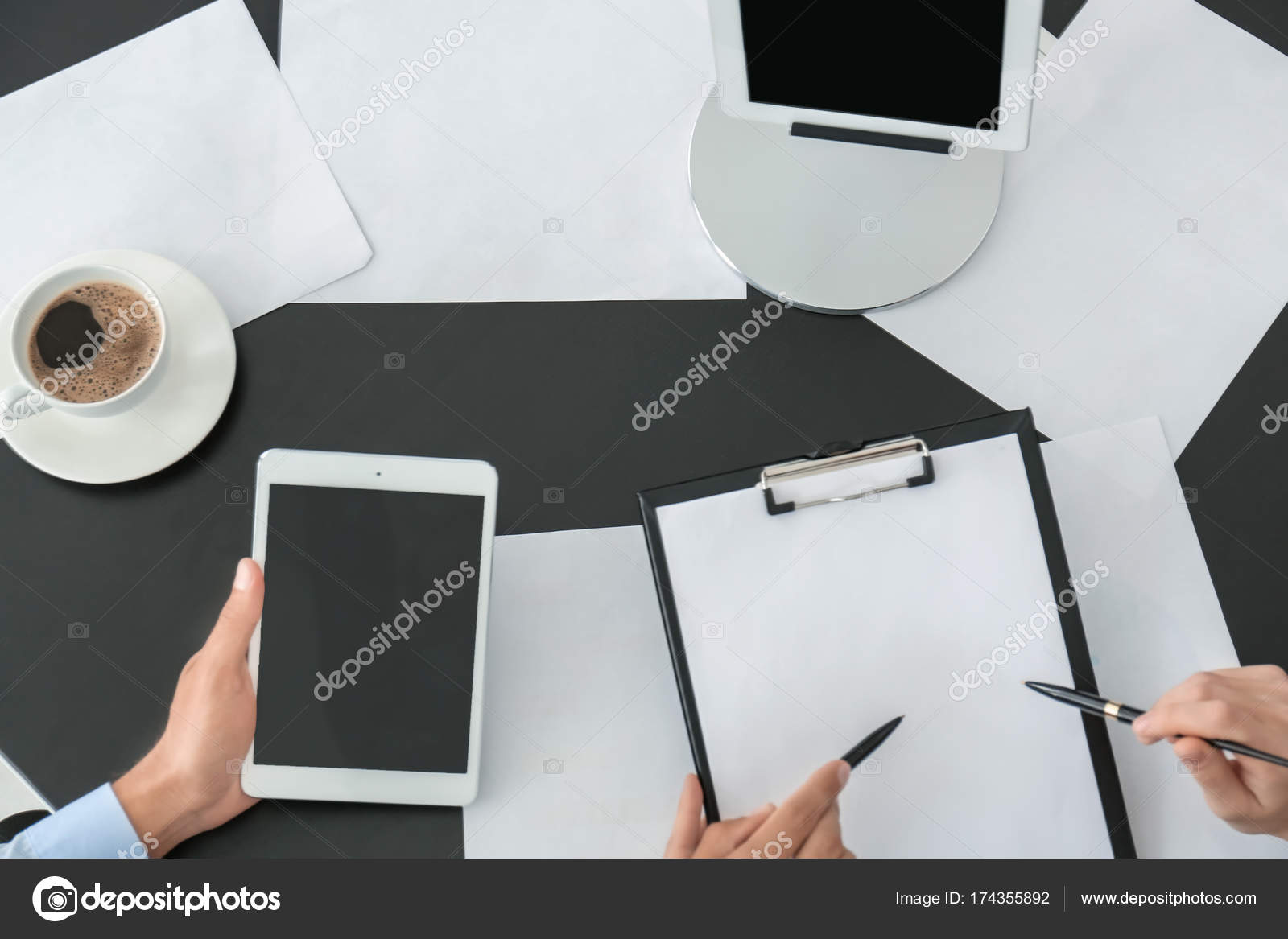 Office employees working at desk Stock Photo by ©belchonock 174355892