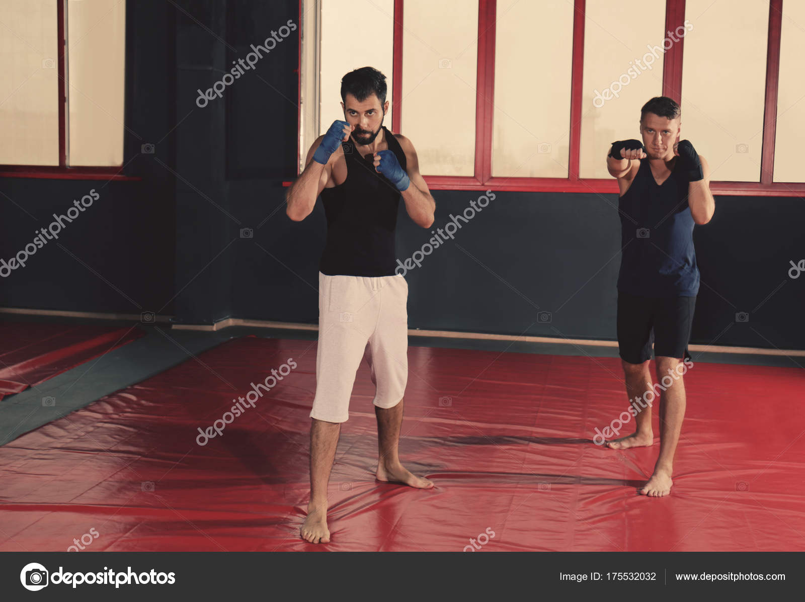 Young professional boxers training — Stock Photo © belchonock #175532032