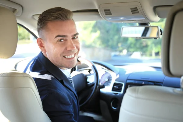 Man on driver's seat of car Stock Photo by ©belchonock 170292484