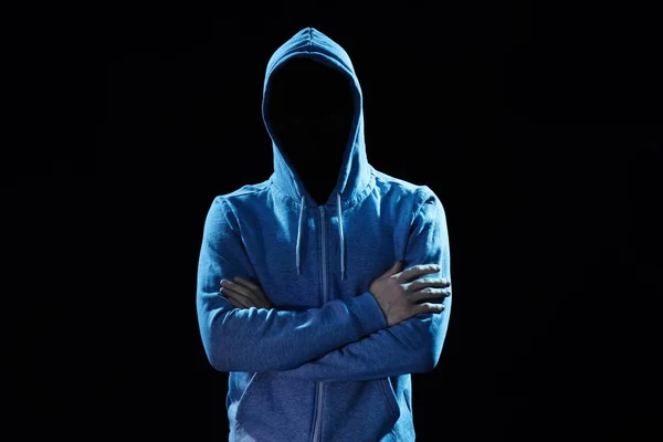 Faceless scary man in a hood against a dark background. — Stock Photo ...