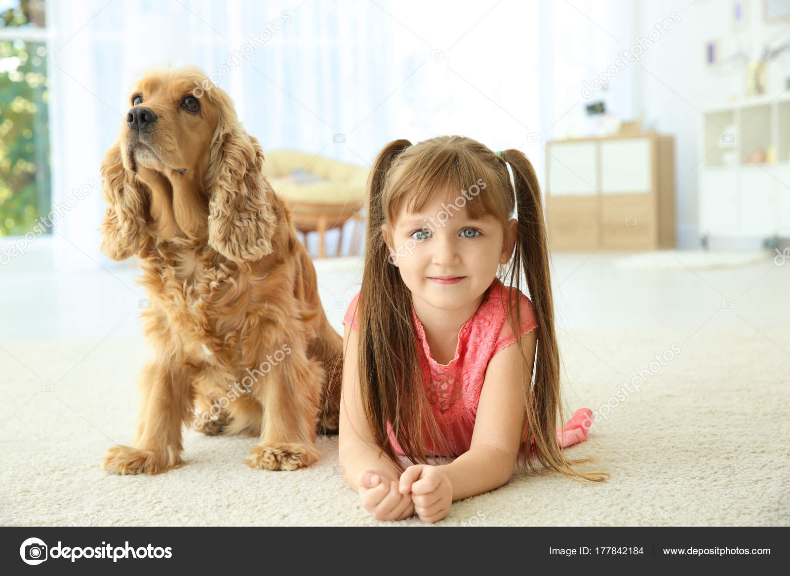 Cute little girl with dog at home Stock Photo by ©belchonock 177842184