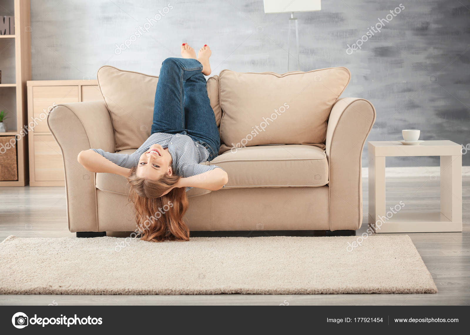 Beautiful woman resting on sofa at home Stock Photo by ©belchonock ...