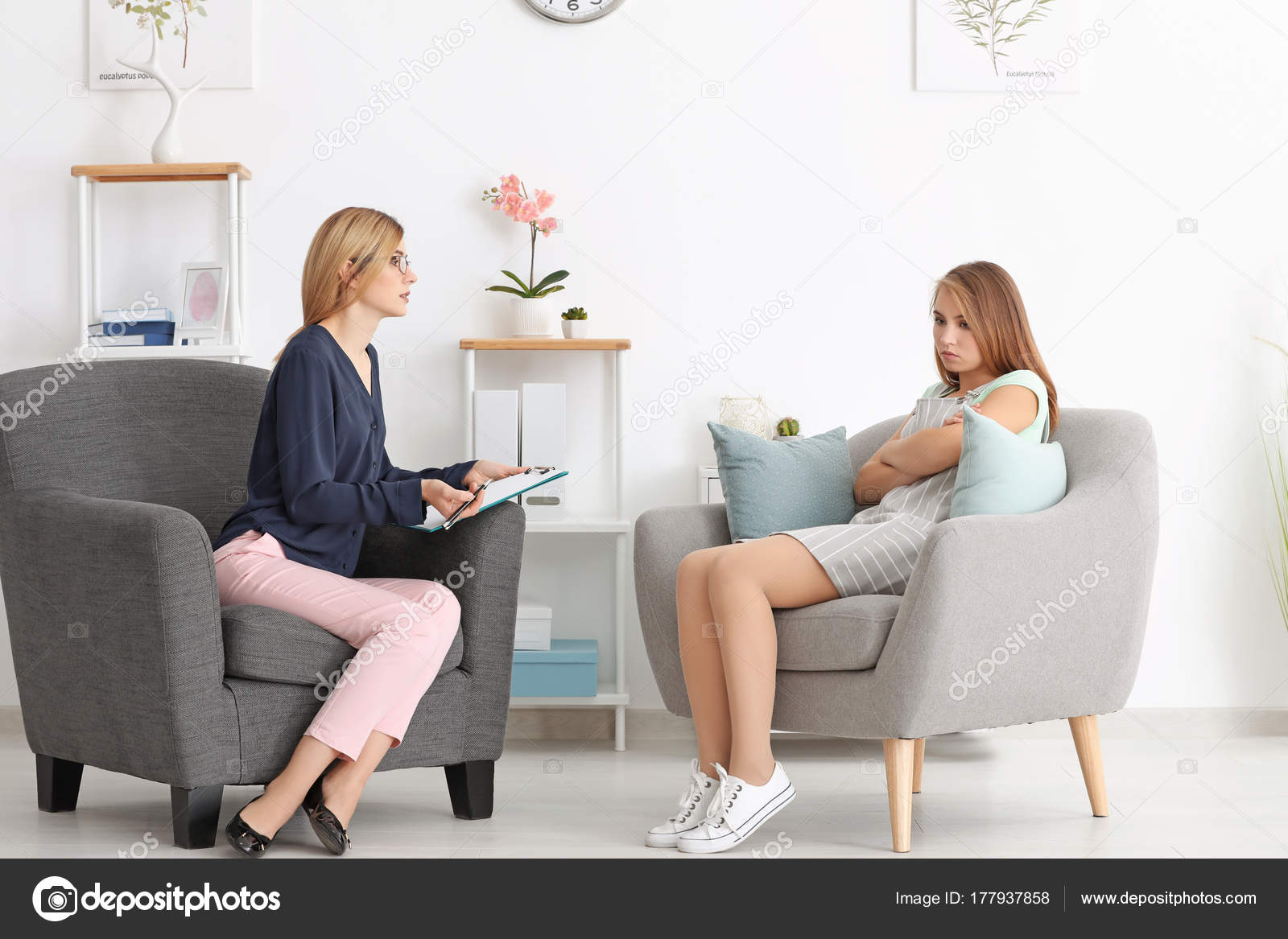 Psychologist working with patient Stock Photo by ©belchonock 177937858