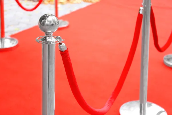 Rope barrier and red carpet Stock Photo by ©belchonock 177210834