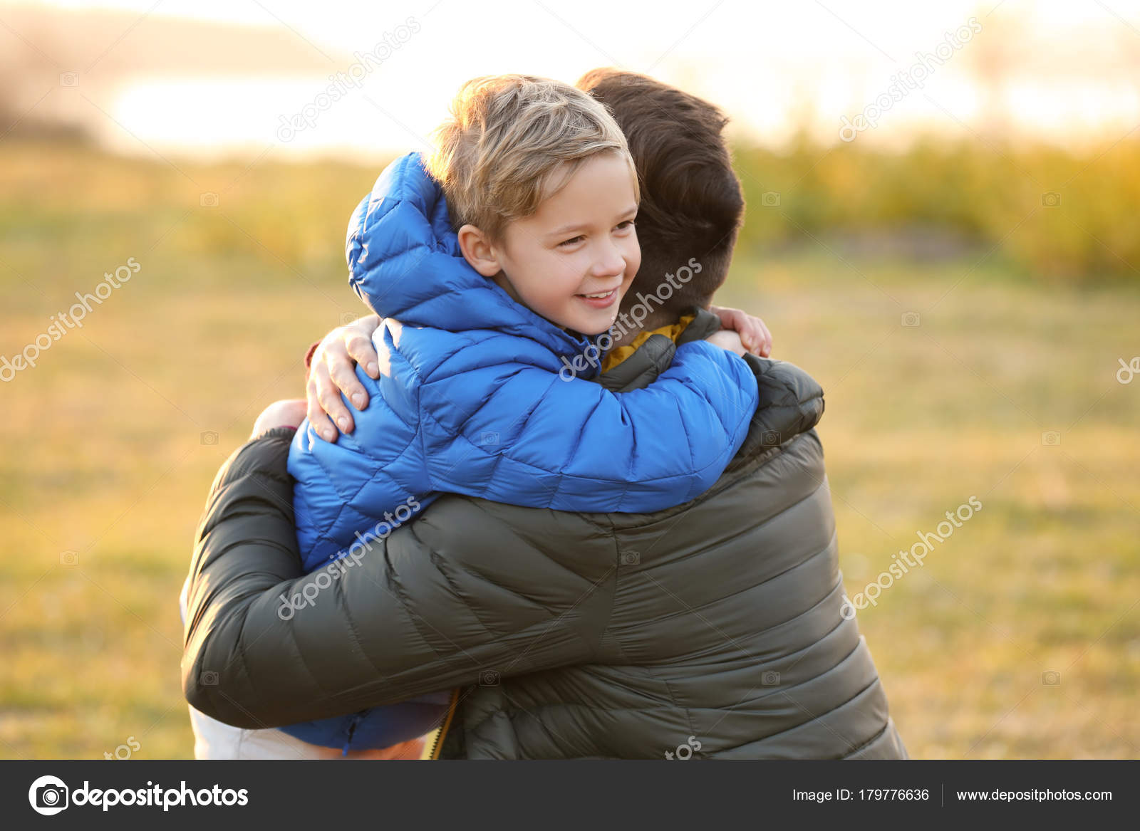 Little boy hugging his father outdoors ⬇ Stock Photo, Image by ...