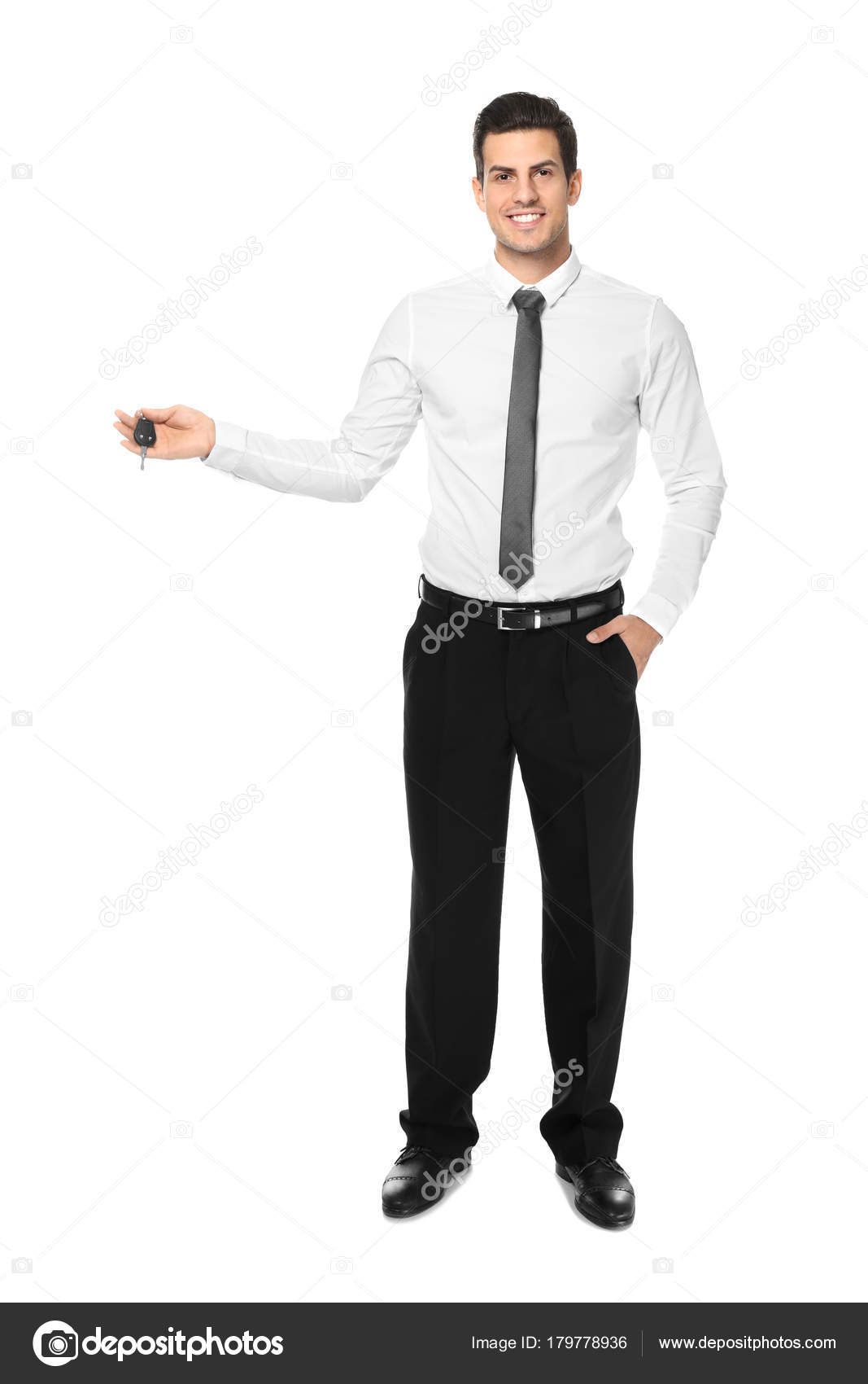 Salesman in formal clothes holding car key on white background Stock ...