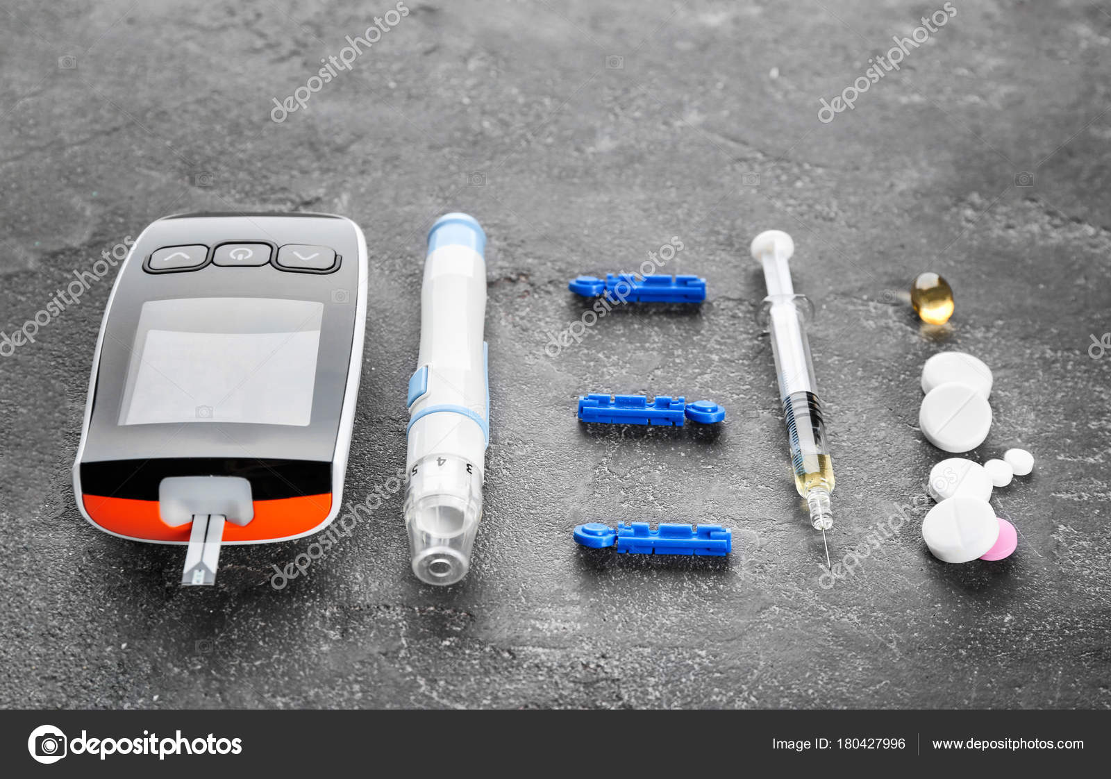 Digital glucometer, syringe and medicaments Stock Photo by ©belchonock ...