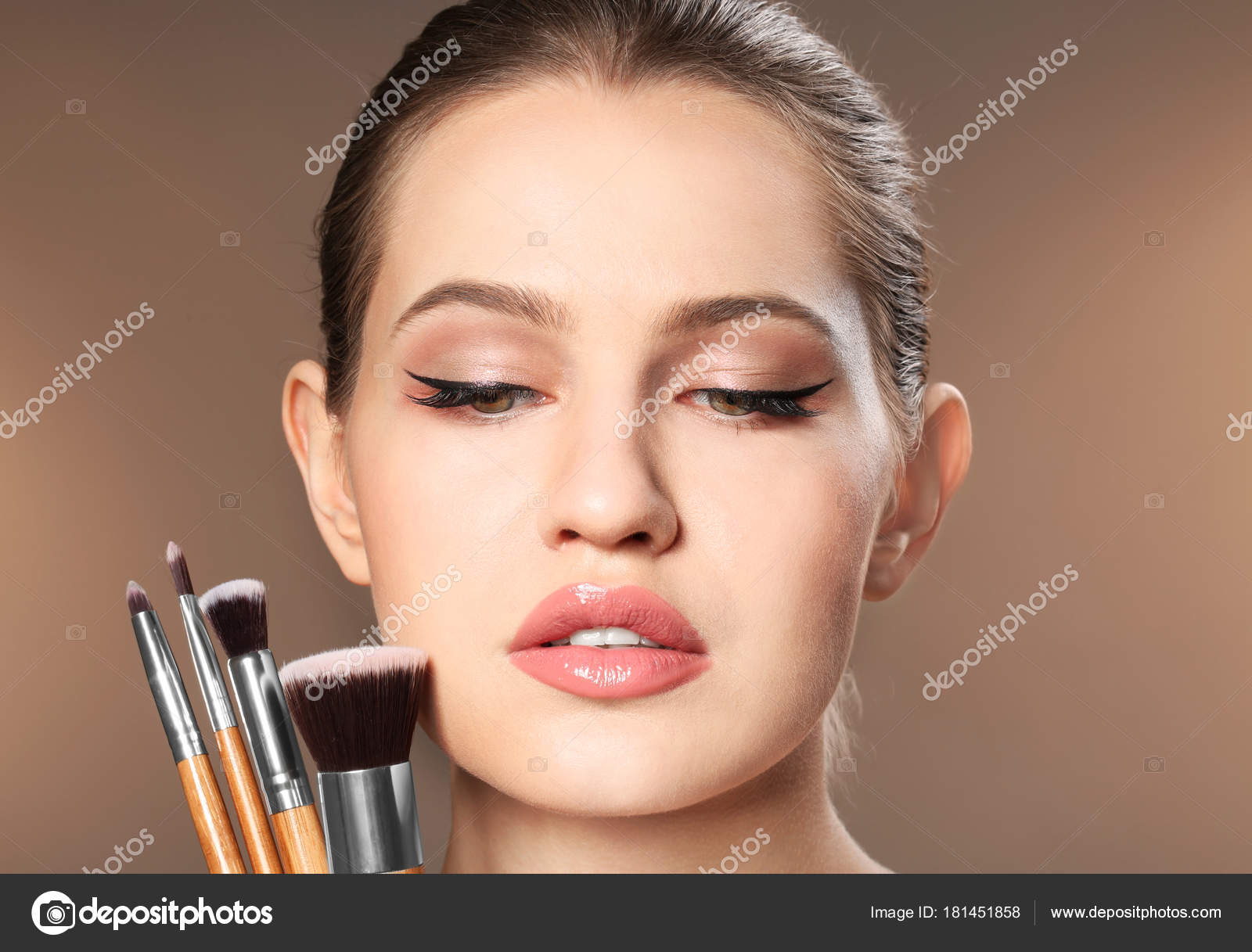 Beautiful woman and makeup brushes on color background. Professional ...