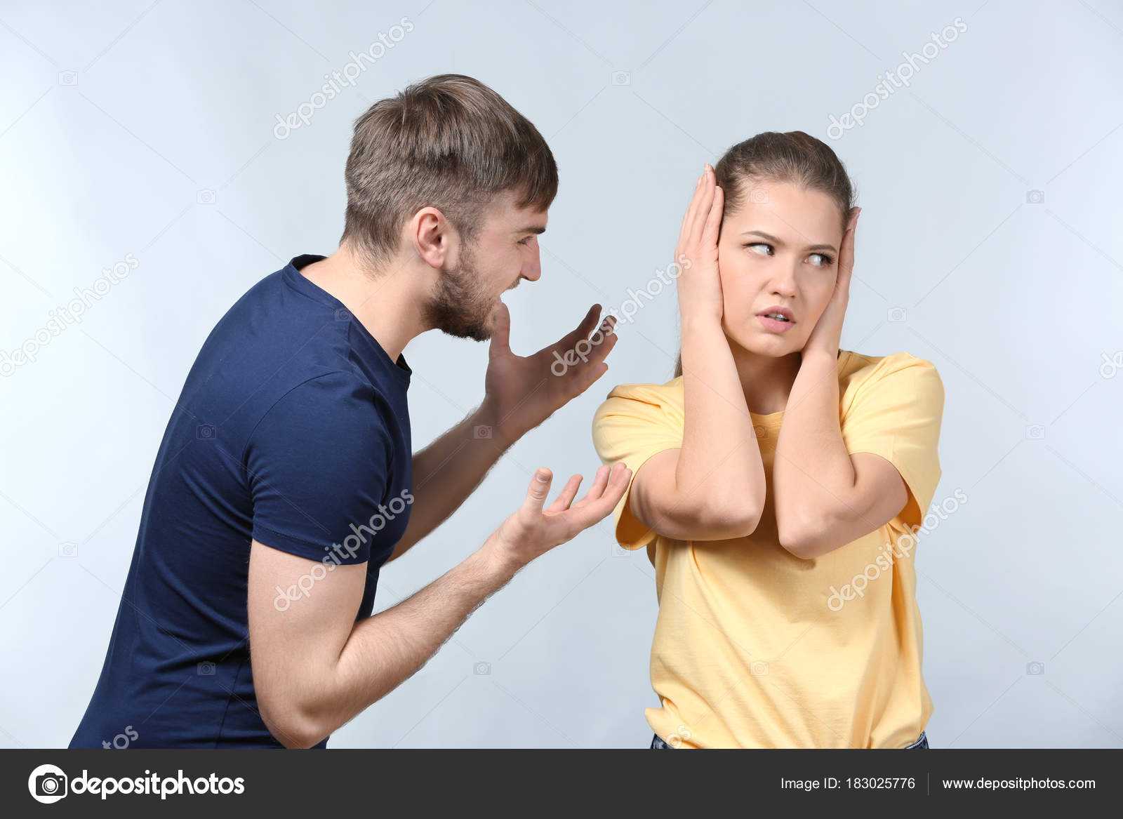 Couple arguing on light background. Problems in relationship Stock ...